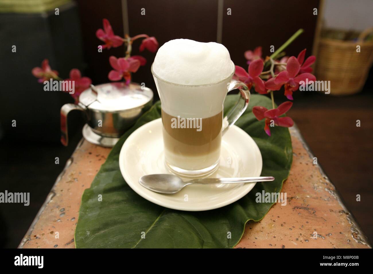 Caffe Latte sitting on a counter top at a cafe in Cologne in August ...