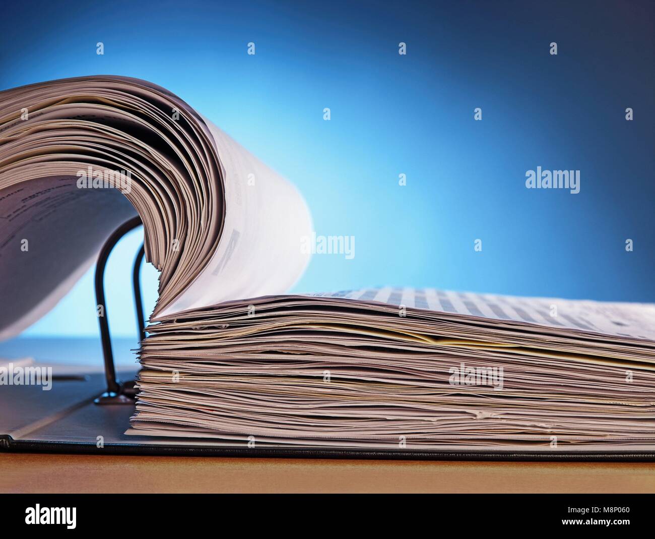 Detail of an open file folder on a blue background | usage worldwide ...