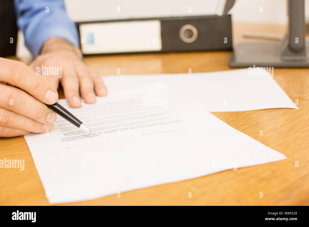 Please sign here - men showing contract to customer or new worker Stock ...