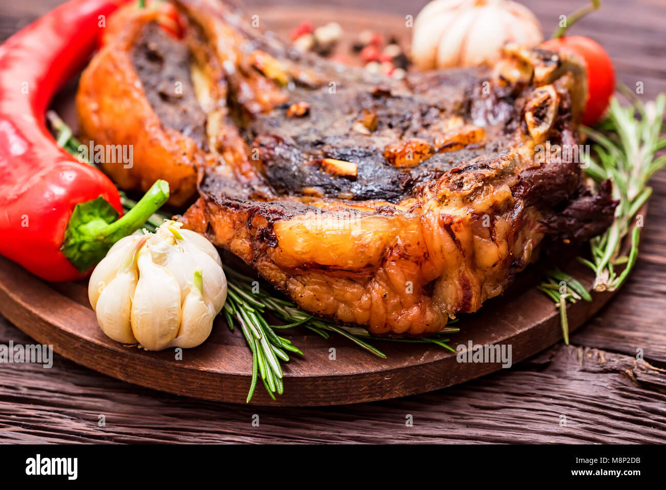 Tasty beef steak with spices and vegetables close Stock Photo - Alamy