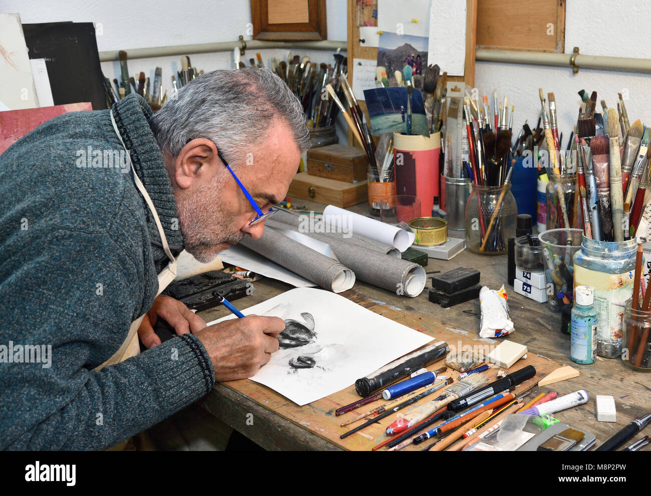 artist drawing in the studio Stock Photo - Alamy