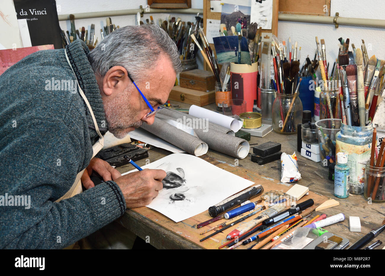 artist drawing in the studio Stock Photo - Alamy