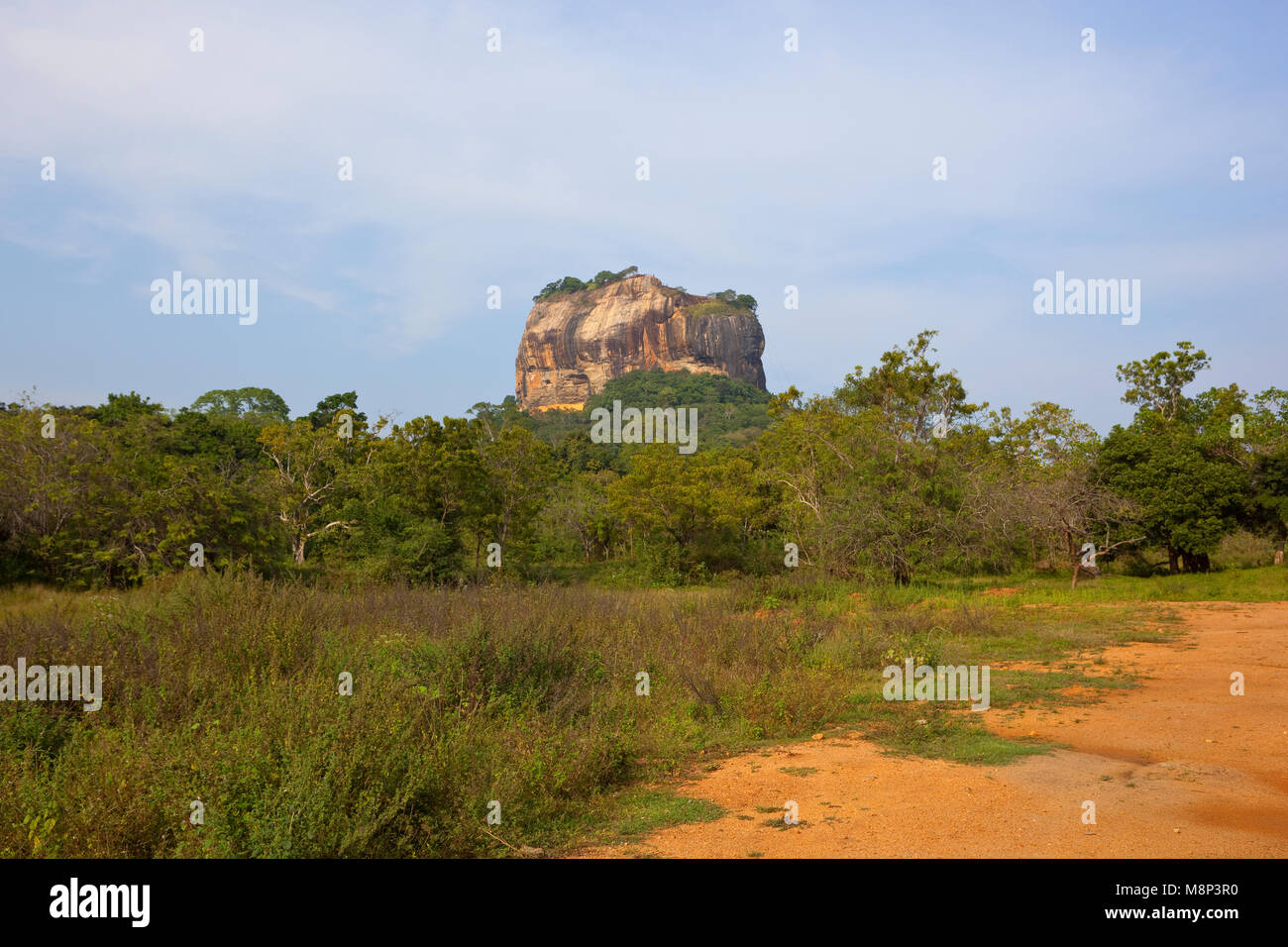 sigiriya rock formation in rural sri lanka with tropical forest and ...