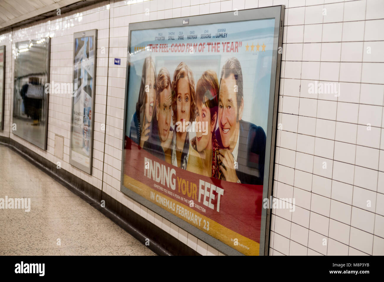 London Underground tube station, escalators, advert signs ...