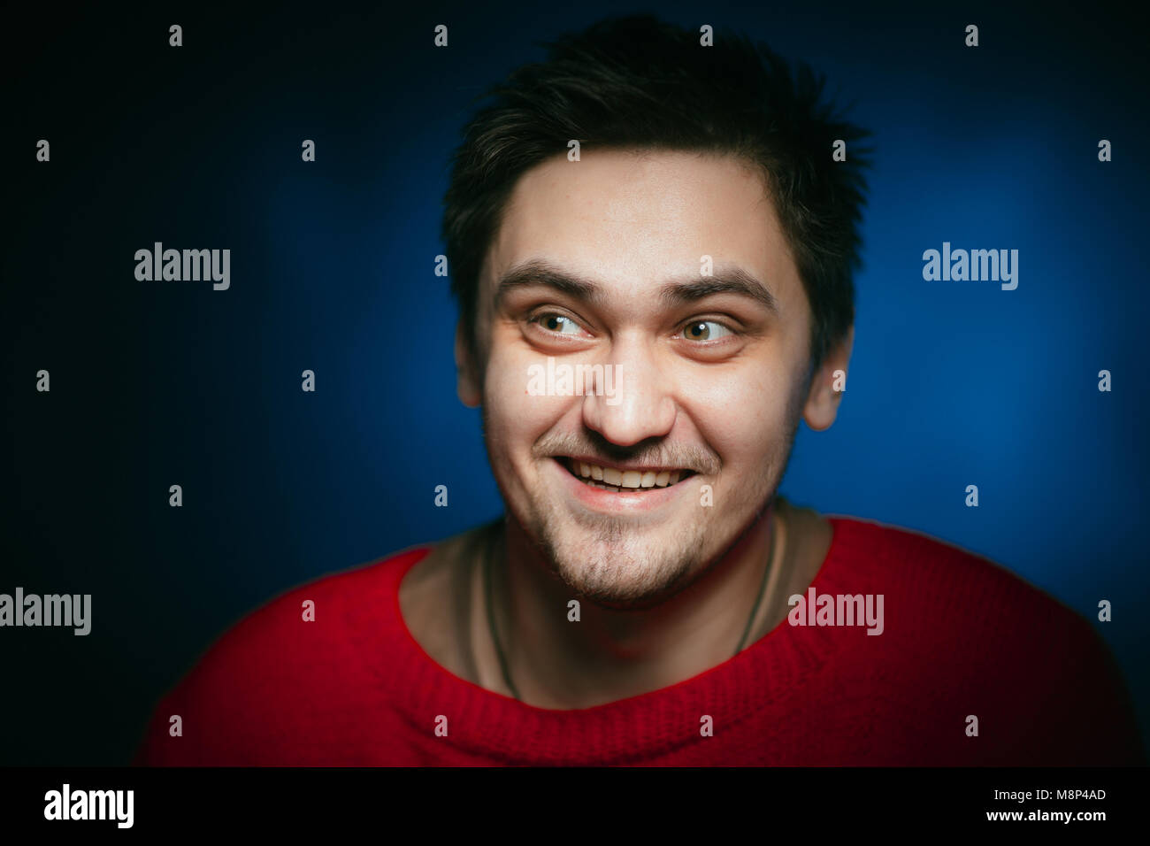 emotional young man photo in studio Stock Photo - Alamy