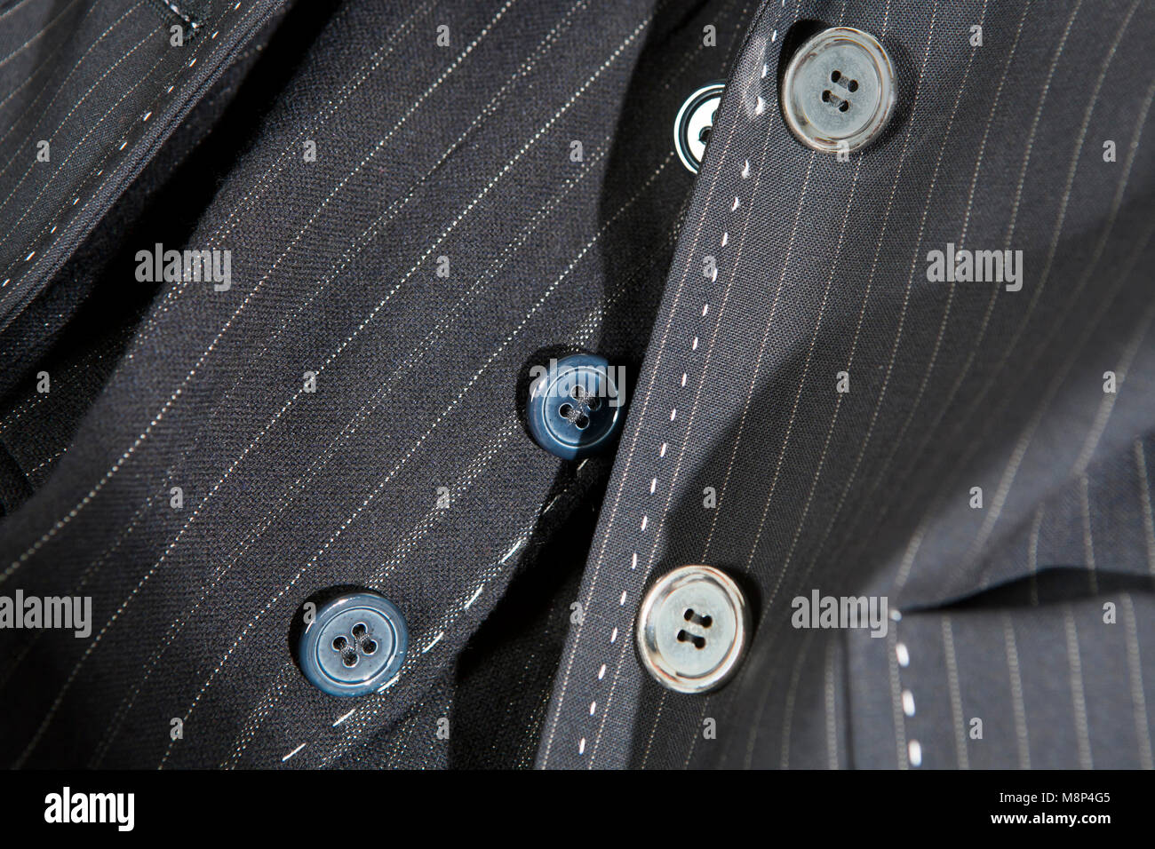 Detail of designer jacket with buttons and stitching Stock Photo - Alamy