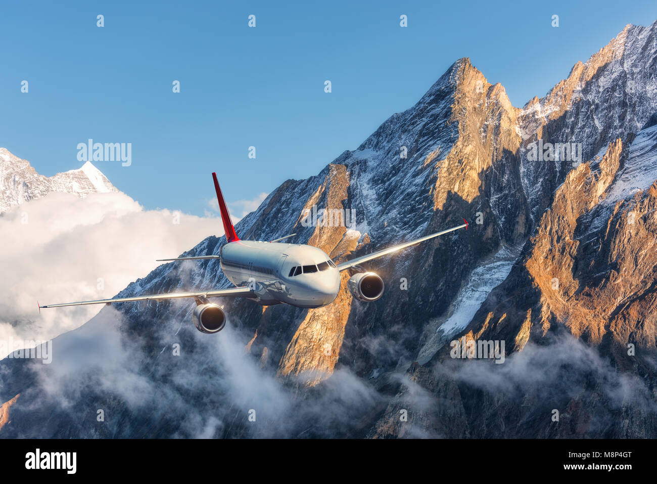 Aeroplane flying over mountain peak hi-res stock photography and images ...