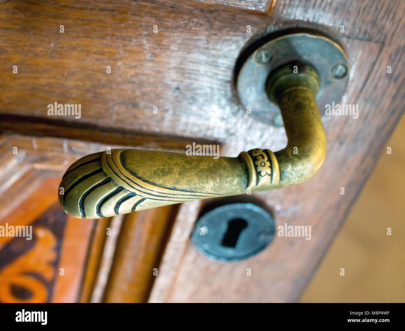 Old bronze door handle in the form of animal paws Stock Photo - Alamy