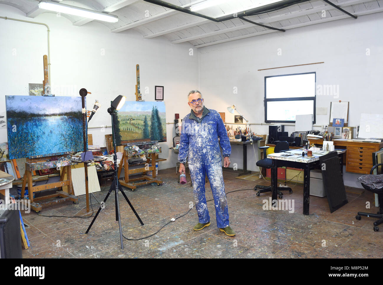 portrait of a painter artist who works in his studio Stock Photo - Alamy