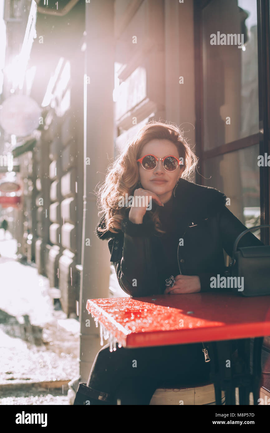 Beautiful lady sitting in street hi-res stock photography and images ...