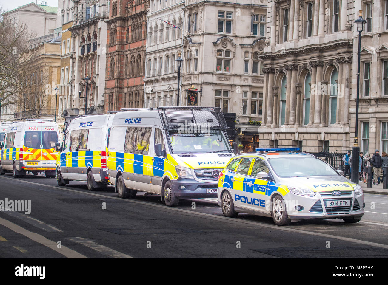Police vehicles lined up on the central reservation of parliament ...