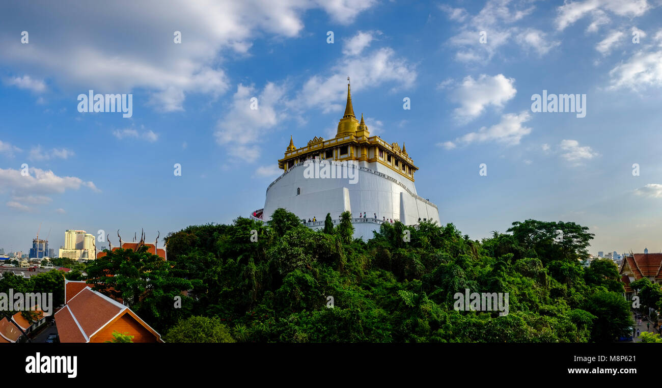 The golden pagoda of Phu Khao Thong, Golden Mount, is located on a hill ...