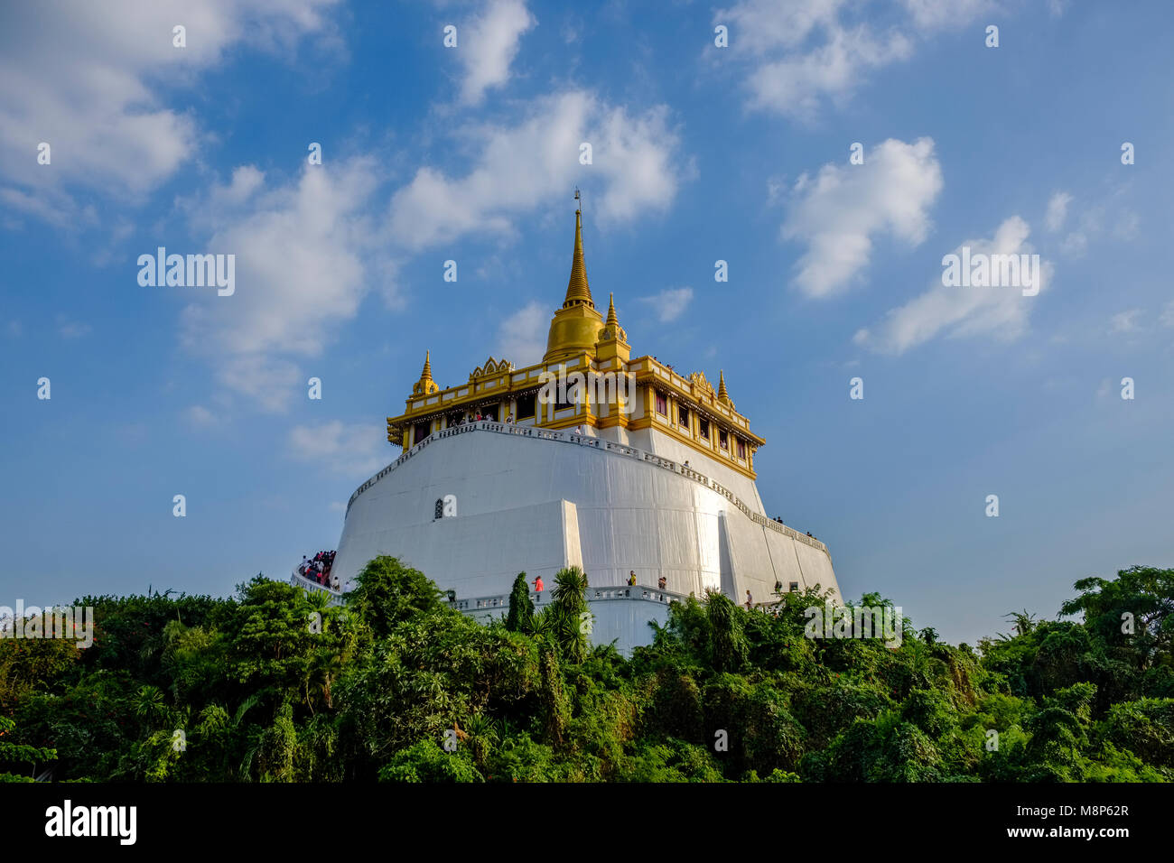The golden pagoda of Phu Khao Thong, Golden Mount, is located on a hill ...
