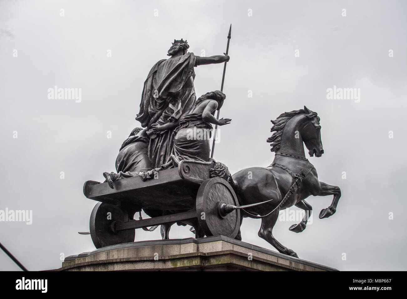 Bronze statue at Westminster bridge by the river Thames of Queen ...