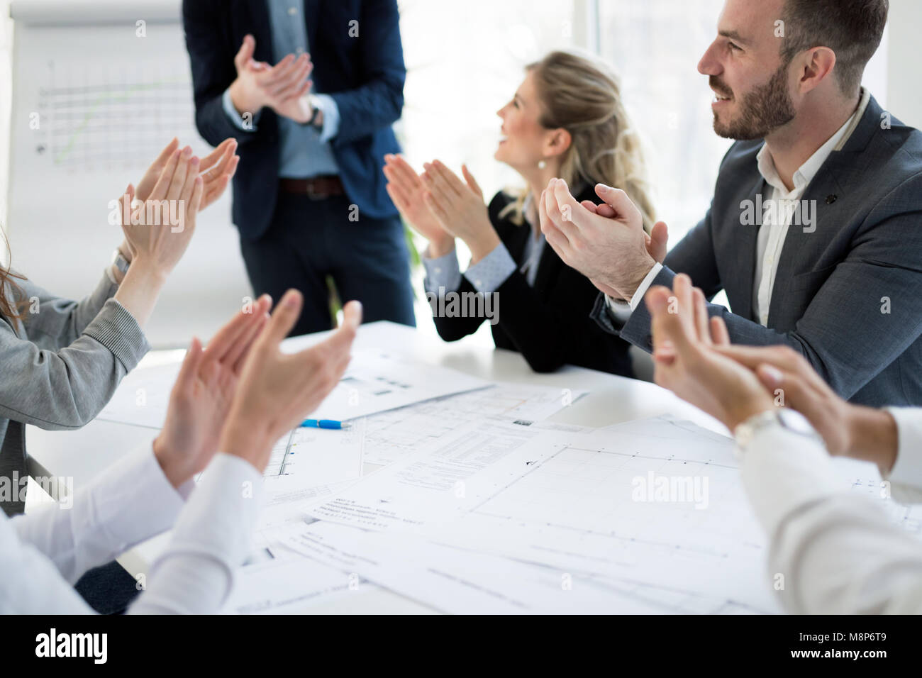 Happy business people achieving success Stock Photo - Alamy