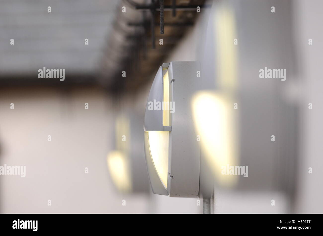 Outside lights on the walls of industrial buildings Stock Photo - Alamy
