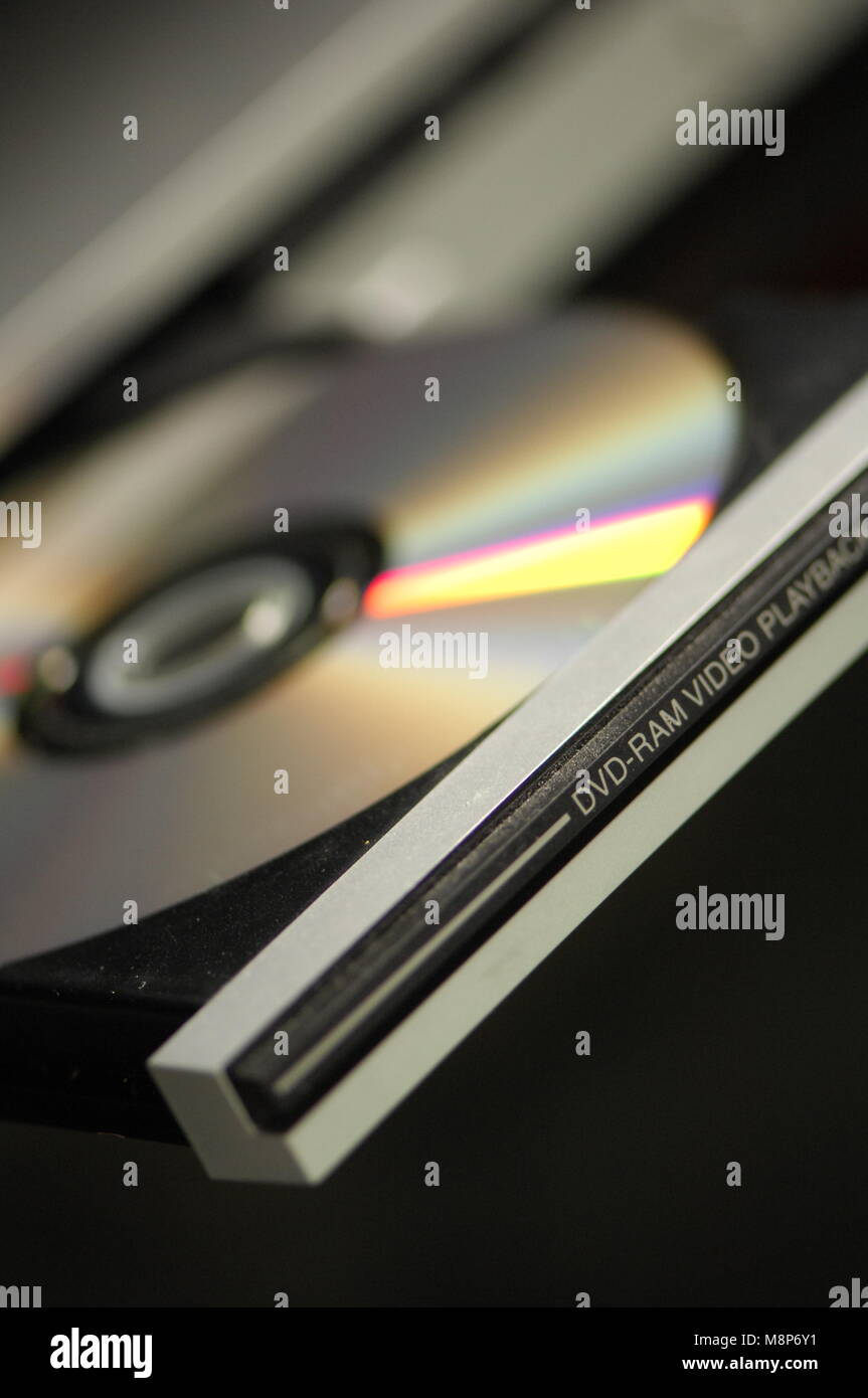 Open draw of cd and dvd player with cd dvd in tray Stock Photo - Alamy