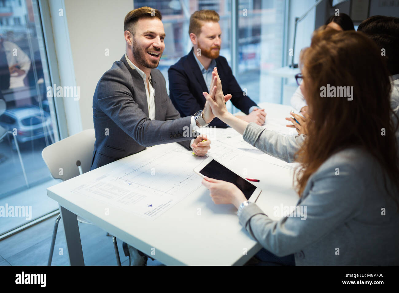 Happy business people achieving success Stock Photo - Alamy