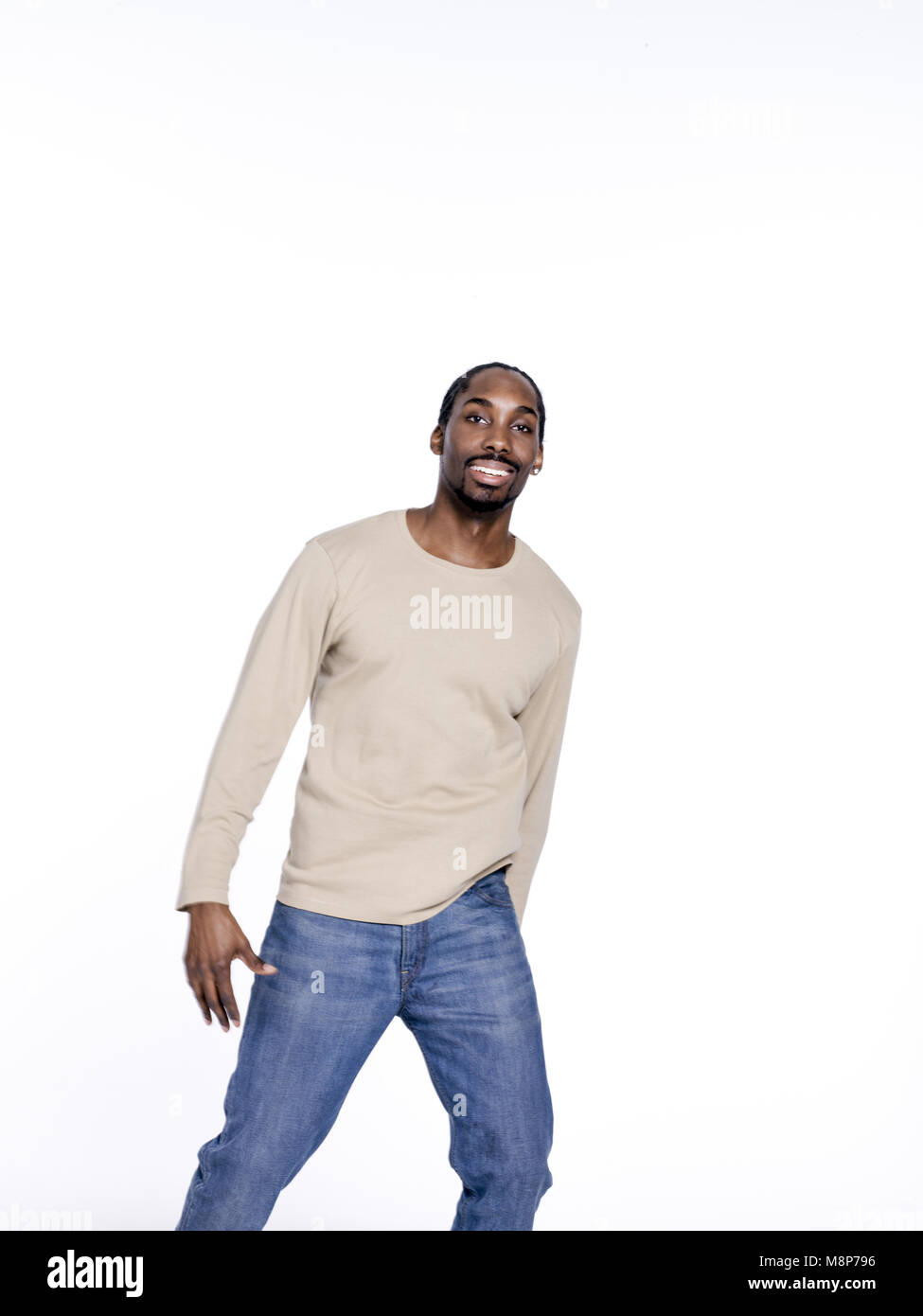 Studio portrait of young black male in his twenties against neutral ...