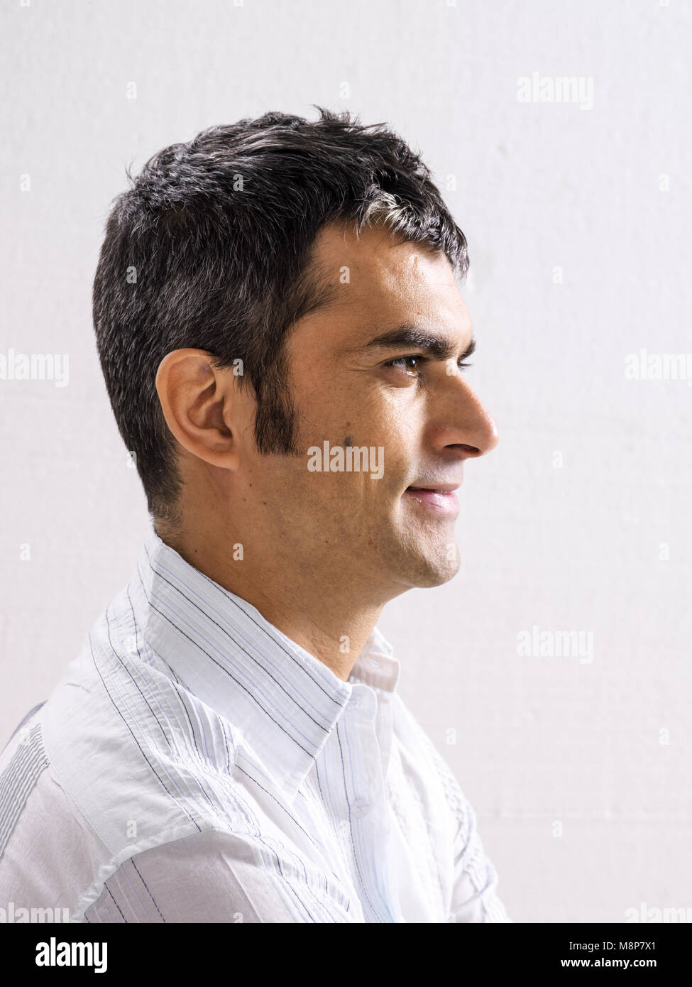 Studio portrait of middle aged white male in his early forties against ...