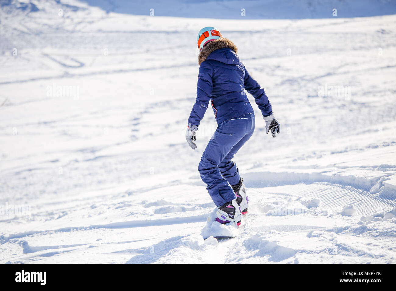 Photo from back of woman snowboarding Stock Photo - Alamy