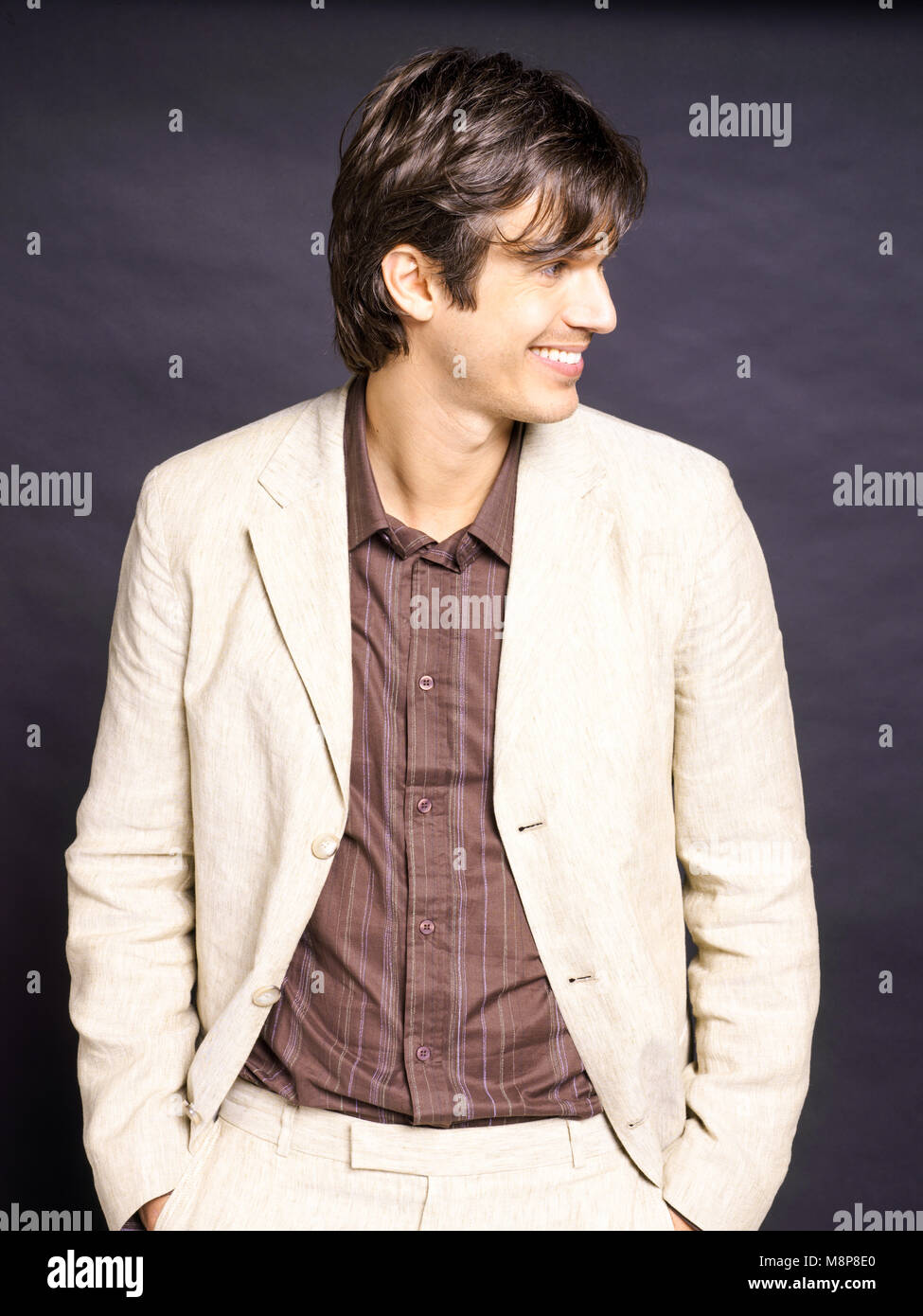 Studio portrait of 30's male against neutral background Stock Photo - Alamy