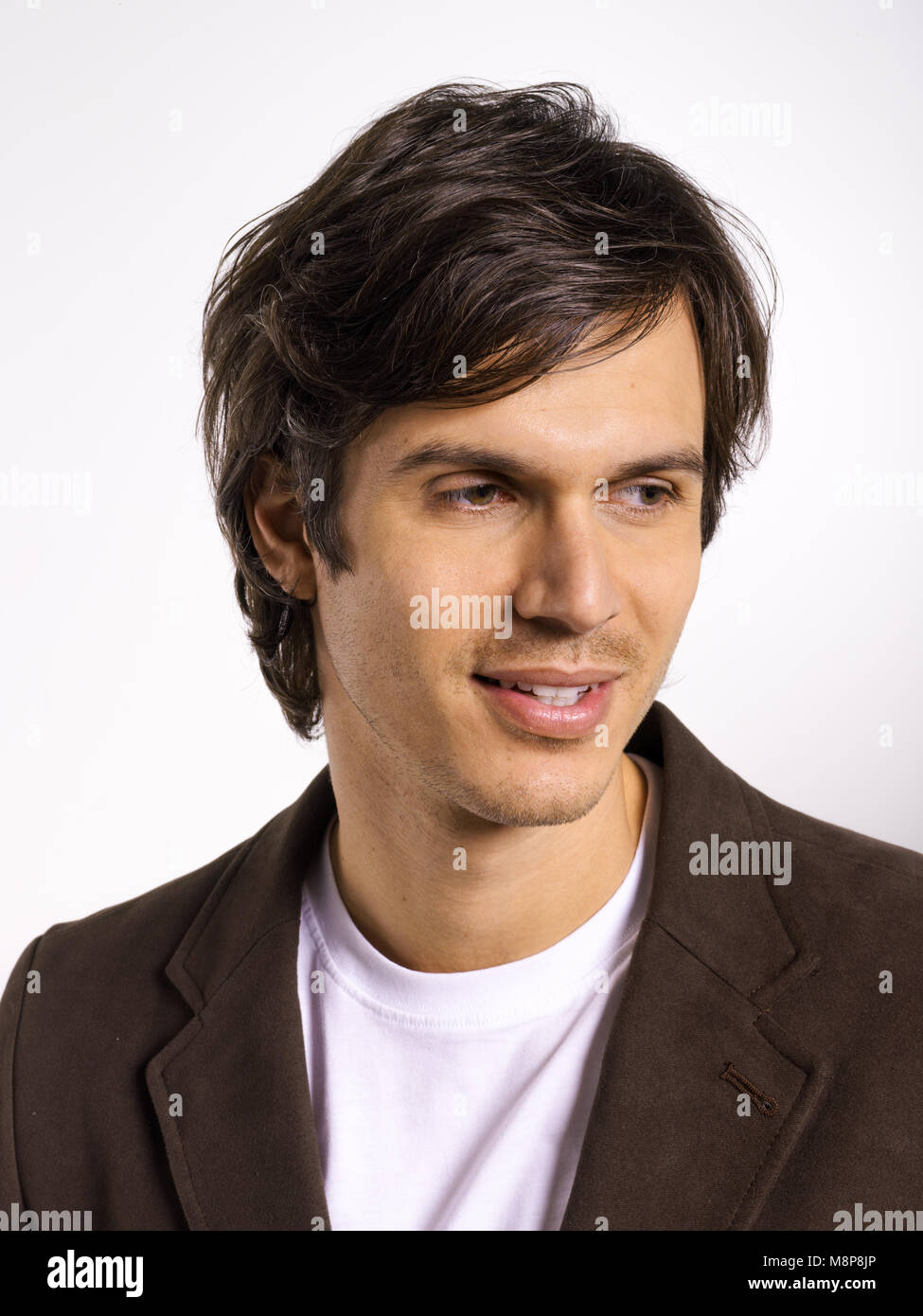 Studio portrait of 30's male against neutral background Stock Photo - Alamy