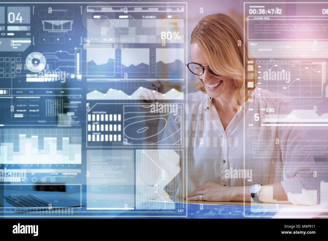 Positive engineer smiling while working with a blueprint Stock Photo ...
