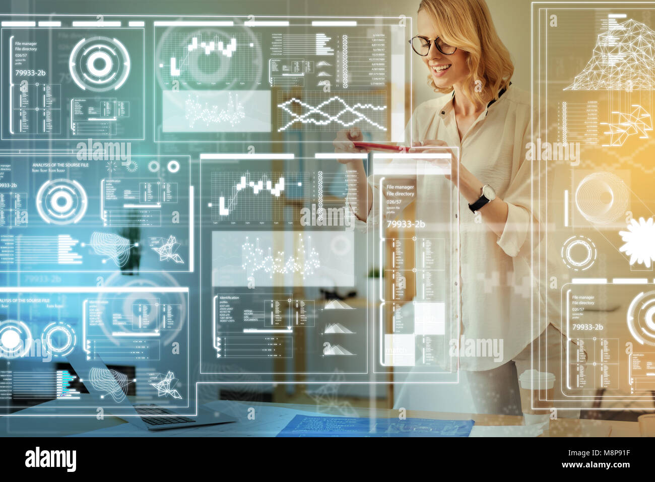 Creative engineer smiling and taking a photo of a blueprint Stock Photo ...
