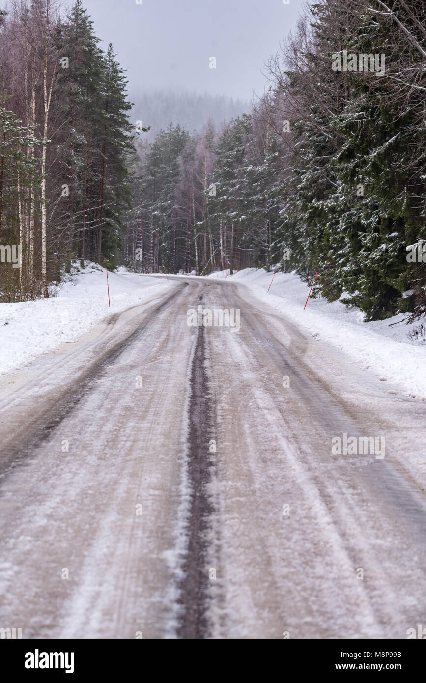 slippery icy road in a swedish forest Stock Photo - Alamy