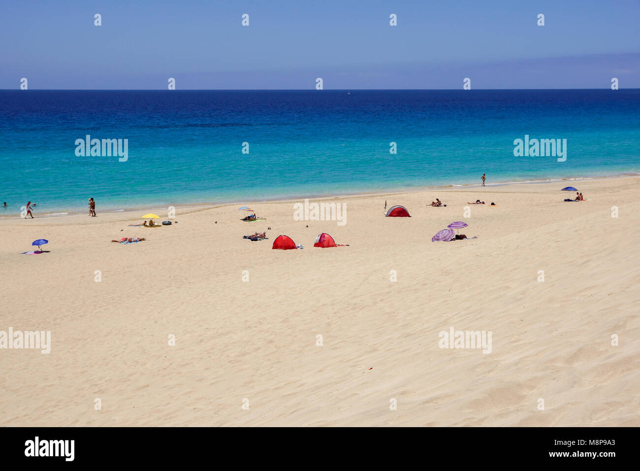 Sand dune and coastal promenade along a beach in Morro Jable town ...