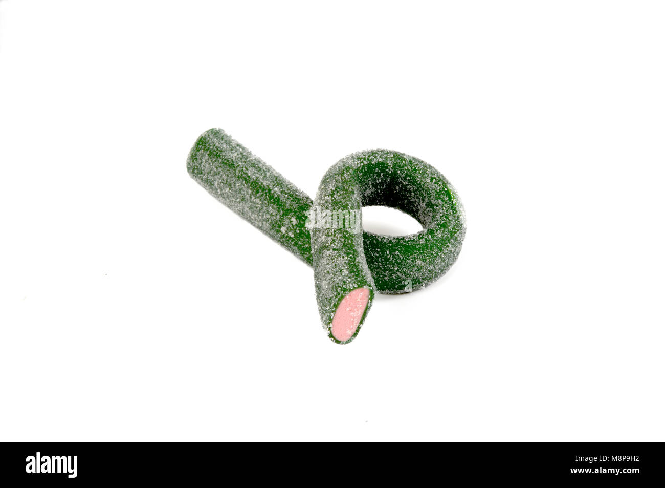 one licorice green candy on white Stock Photo - Alamy