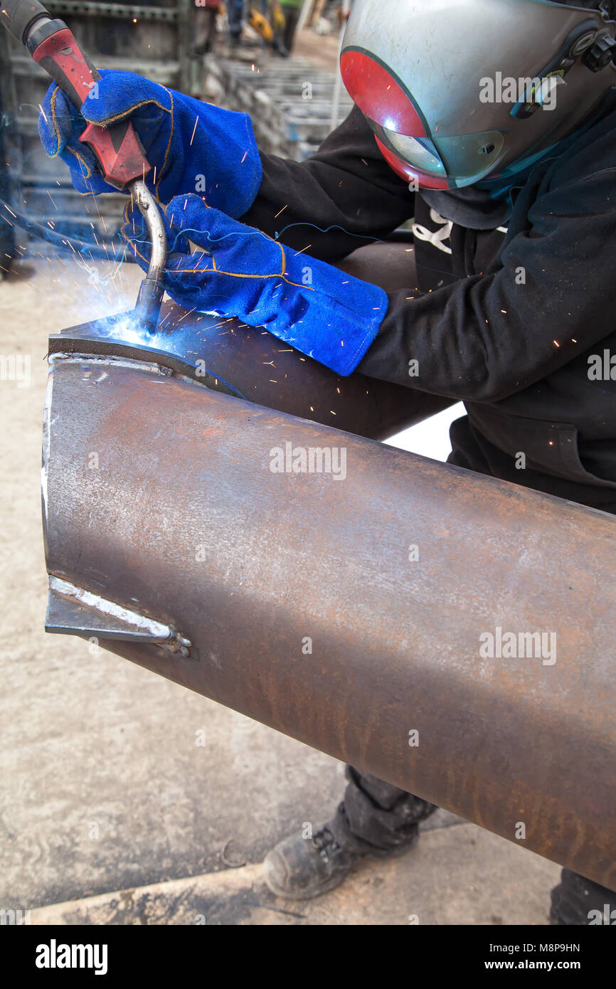 Welding work, welder welding metal material in heavy industry ...