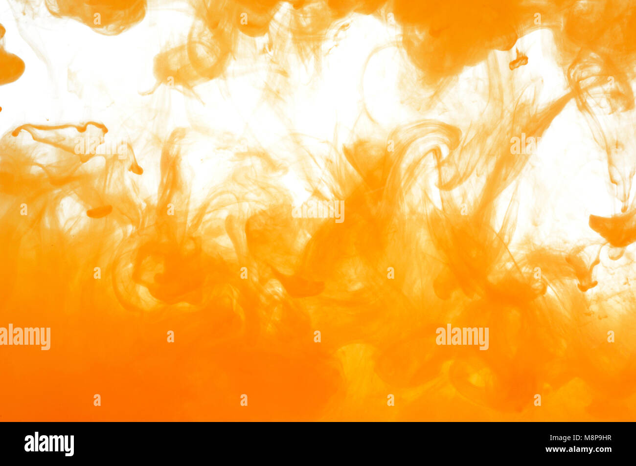 color dissolved in water with white background Stock Photo - Alamy