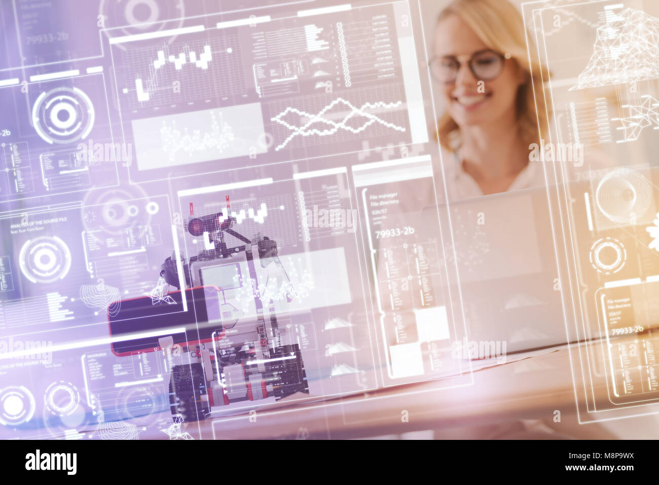 Adorable robot holding a smartphone and an engineer feeling happy Stock ...