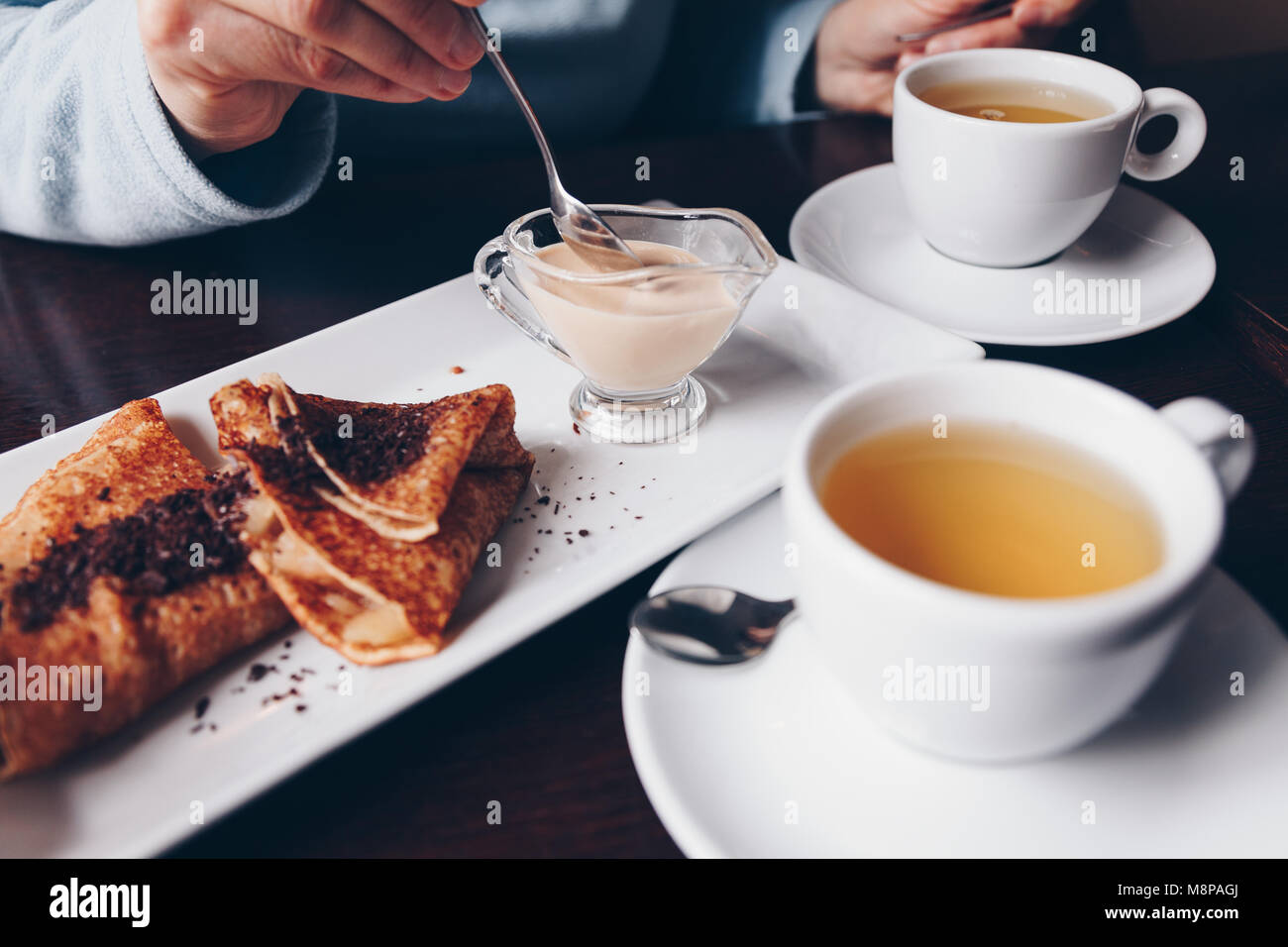 The Time of Tea Break - Table with desserts and tea Stock Photo - Alamy