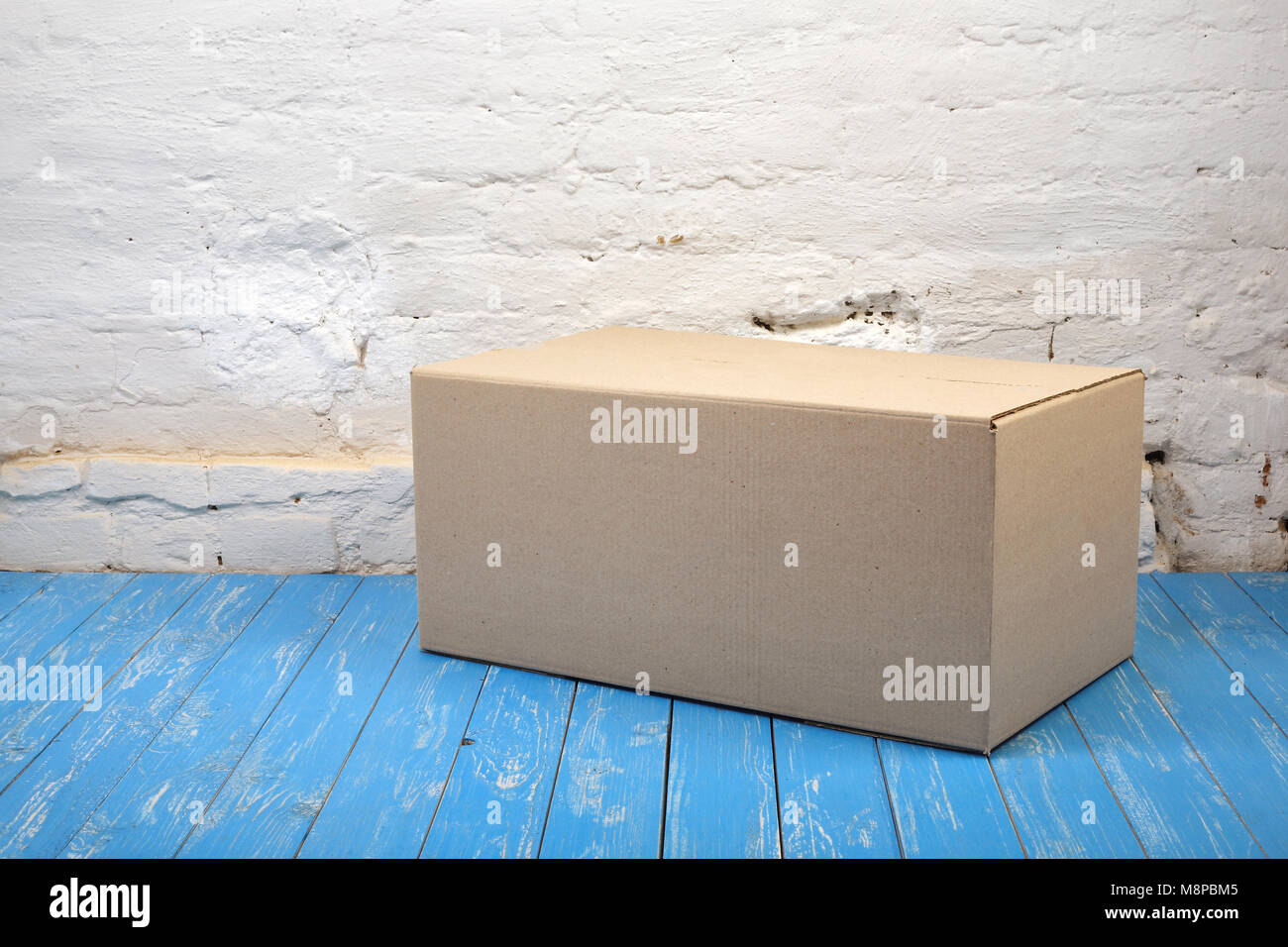 Postage and packing service - Close Package on a blue wood and white ...