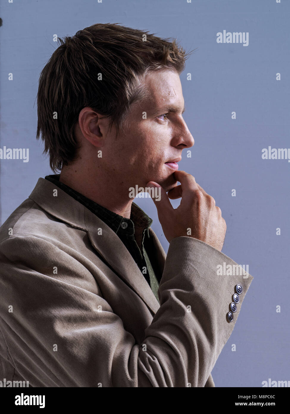 studio portrait of attractive white male headshot against neutral ...