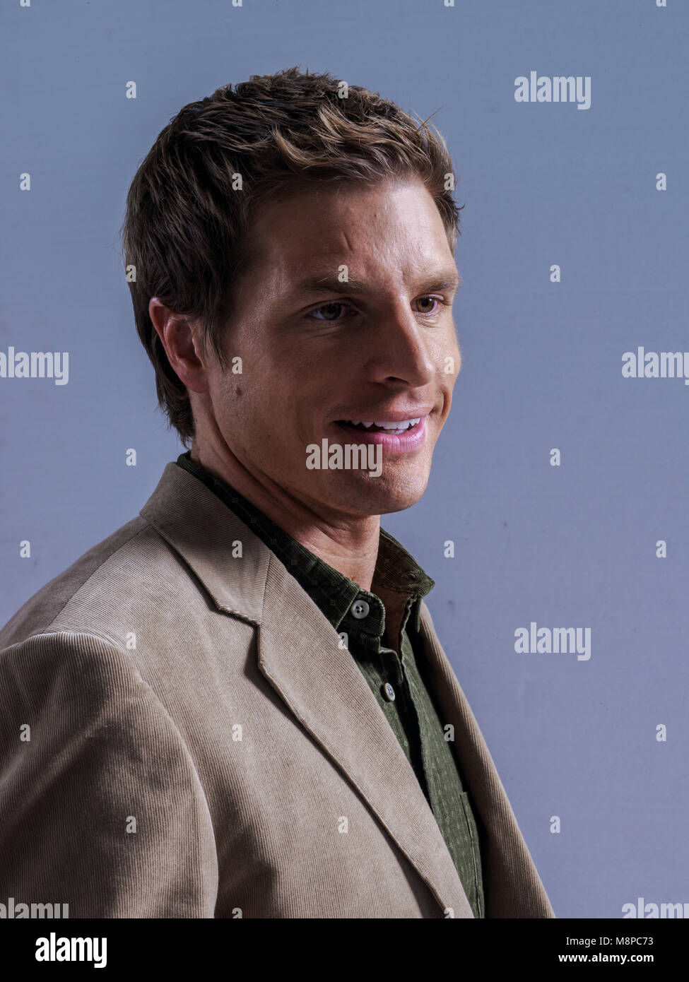 studio portrait of attractive white male headshot against neutral ...