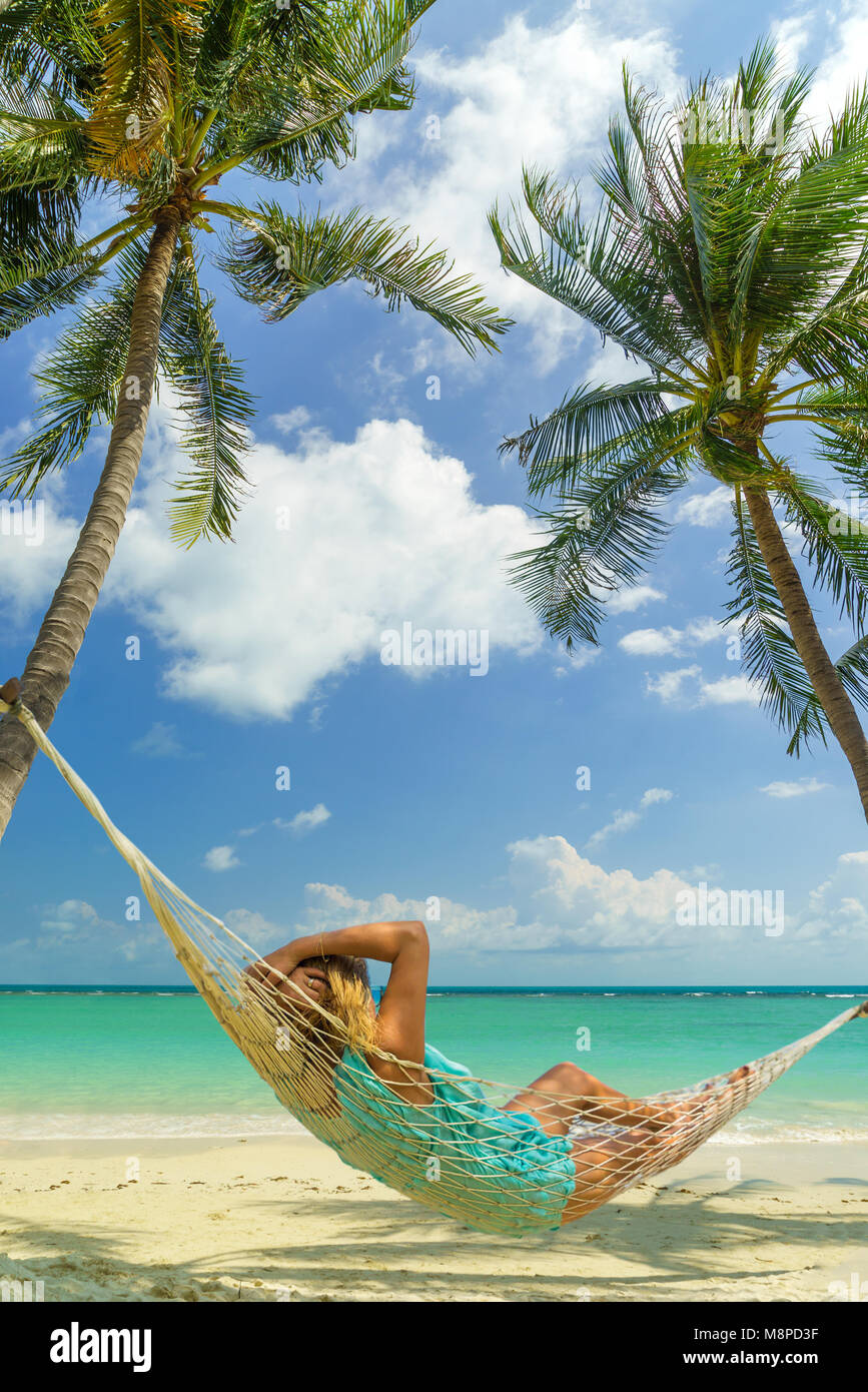 Model beach in hammock hi-res stock photography and images - Alamy