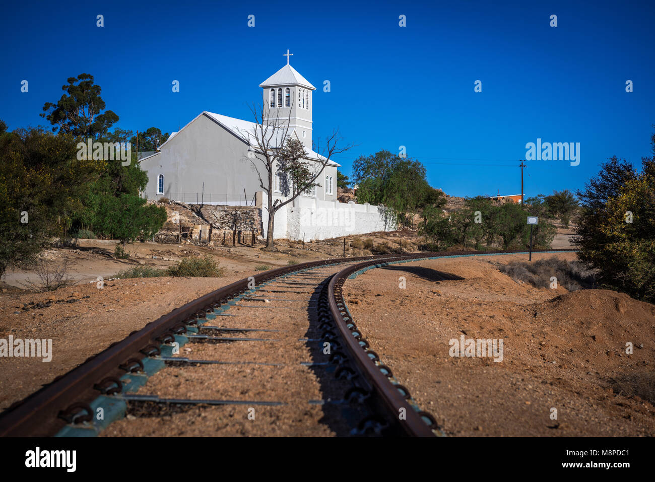 The church in the Namibian town of Aus next to the railway line that ...