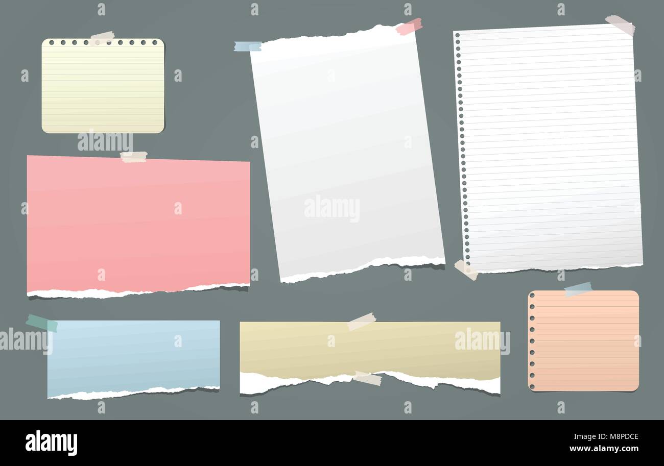 Pieces of torn colorful and white, lined note, notebook paper strips ...