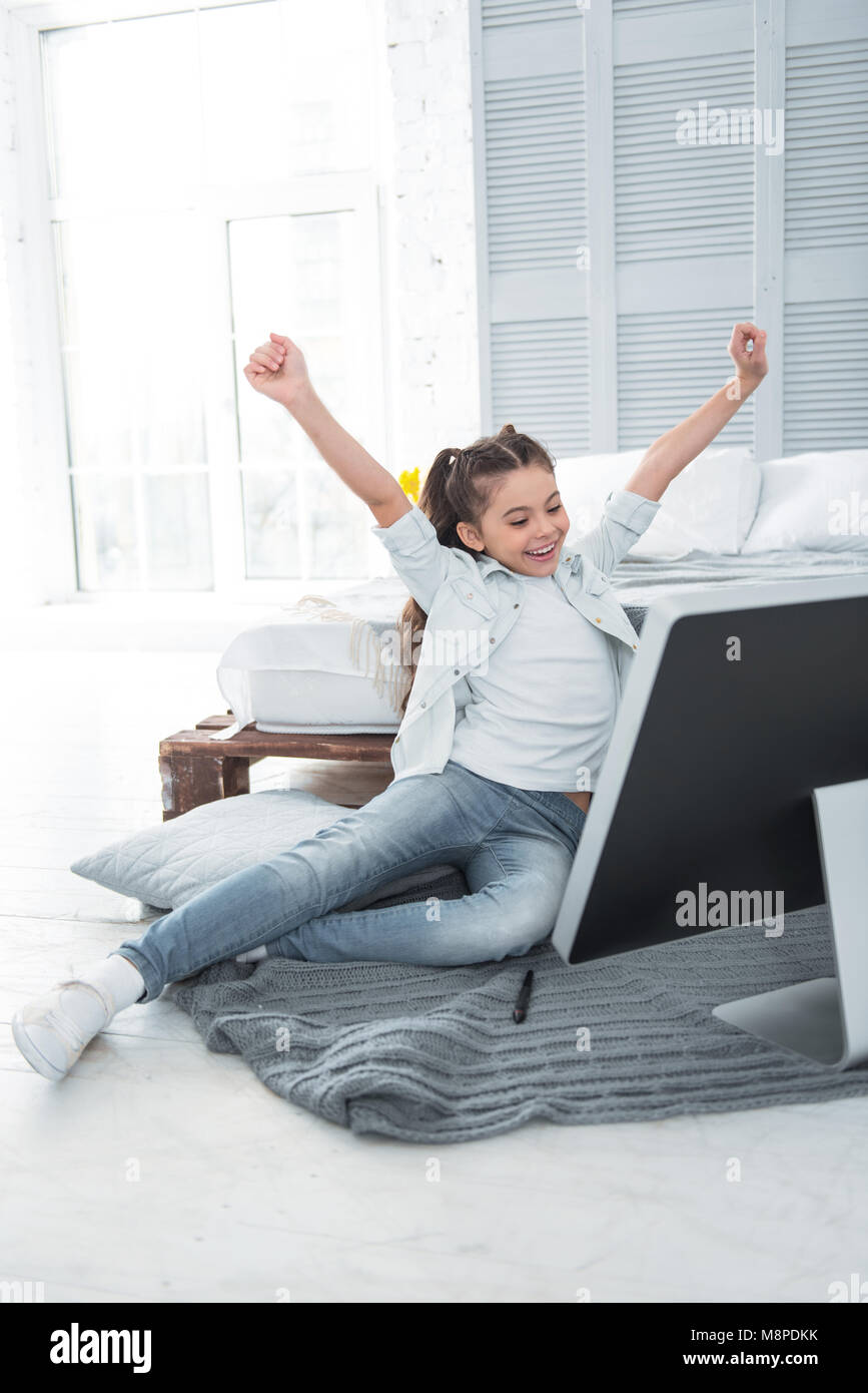 Positive cute girl feeling happy Stock Photo - Alamy