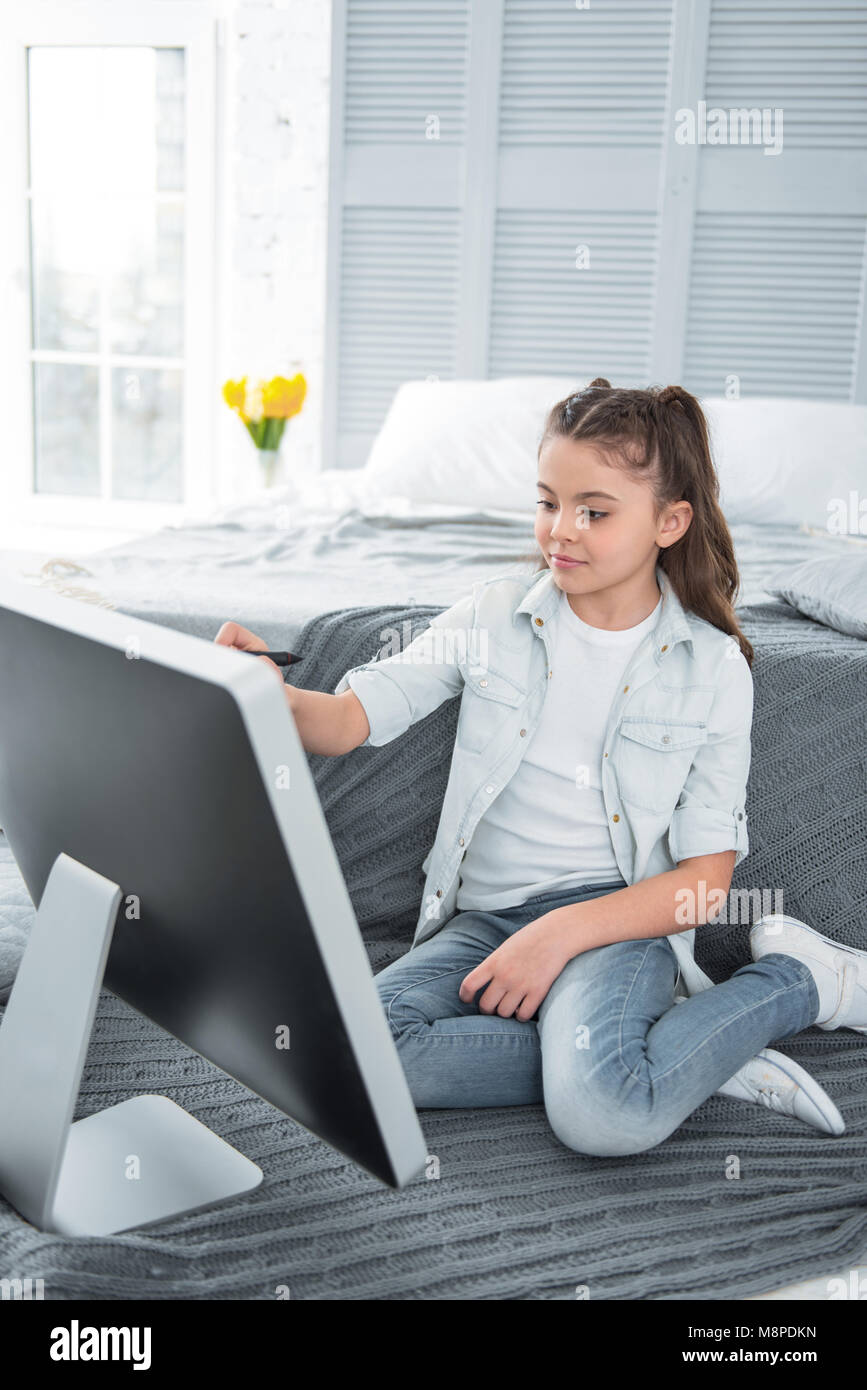 Smart cute girl using modern tech Stock Photo - Alamy