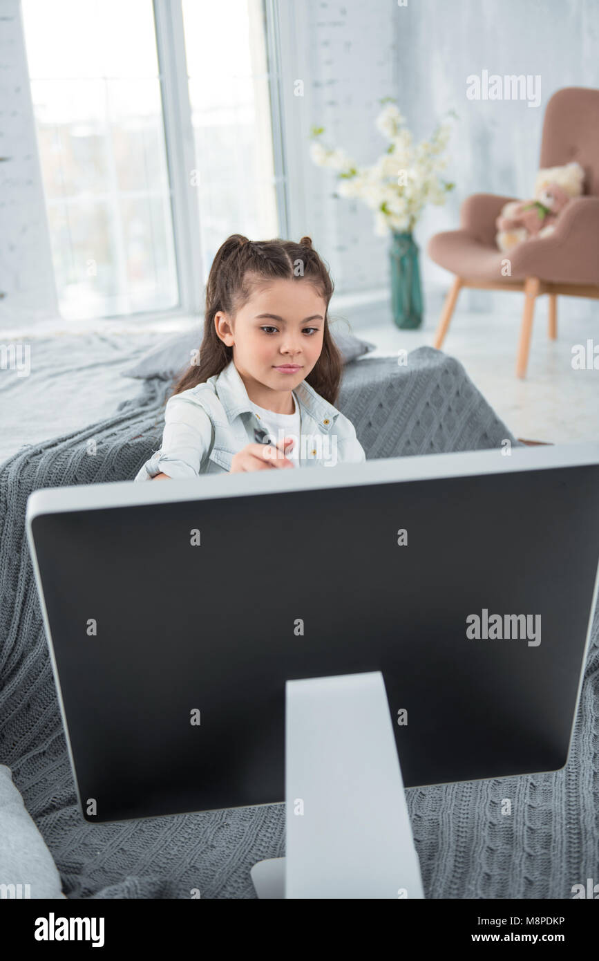 Pleasant cute girl writing Stock Photo - Alamy