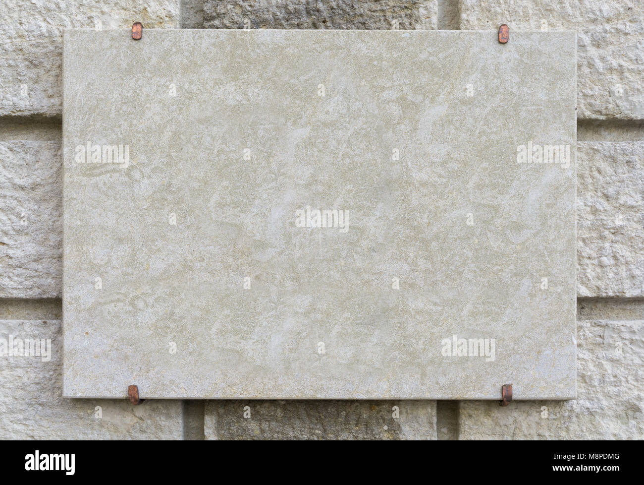 Blank stone sign with copyspace on the wall Stock Photo - Alamy