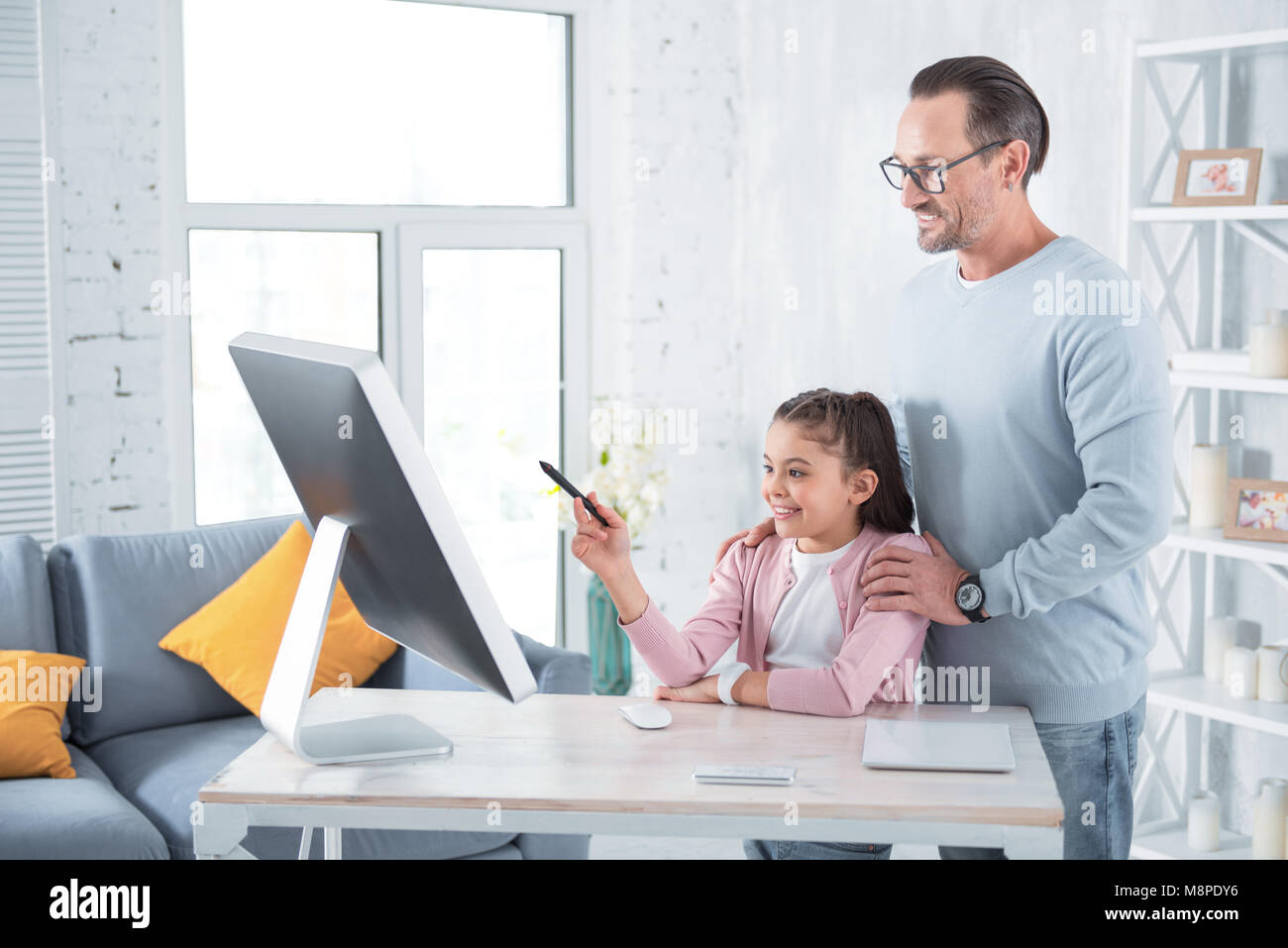 Positive intelligent girl studying Stock Photo - Alamy