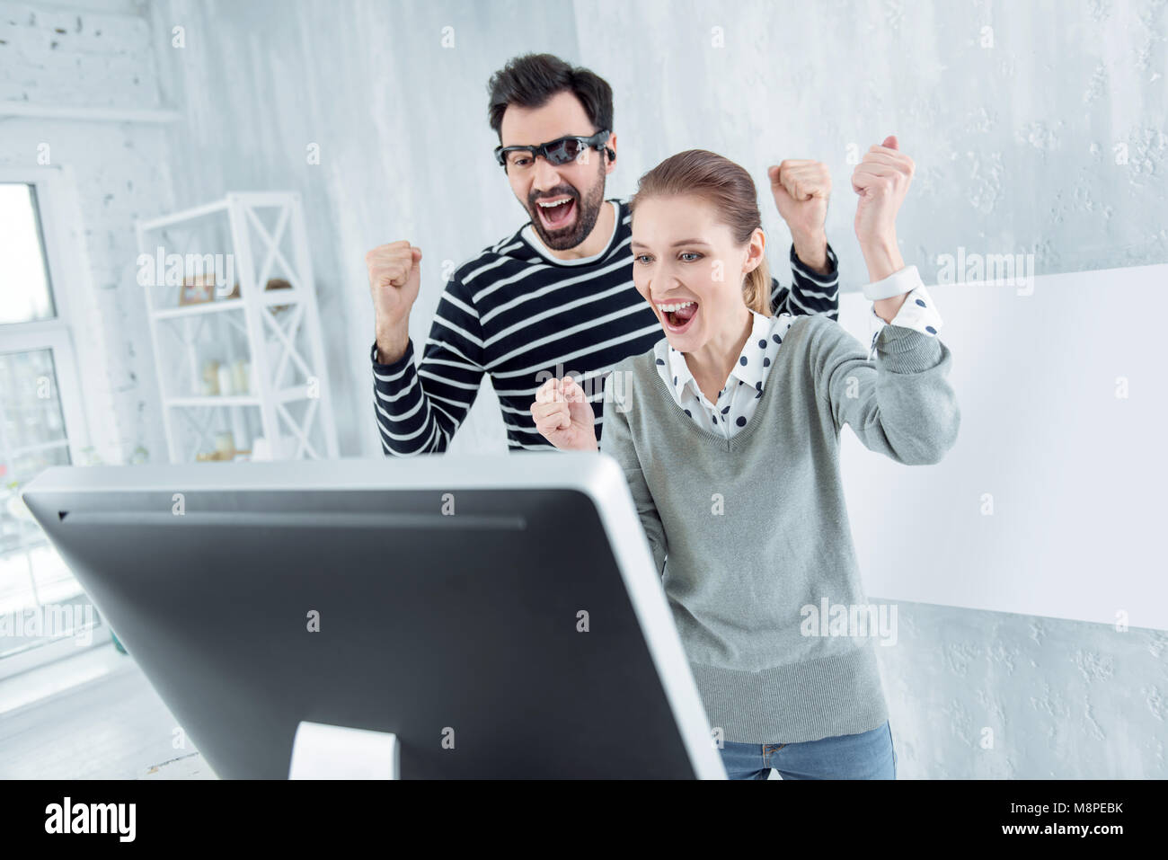Attractive young female being very glad Stock Photo - Alamy