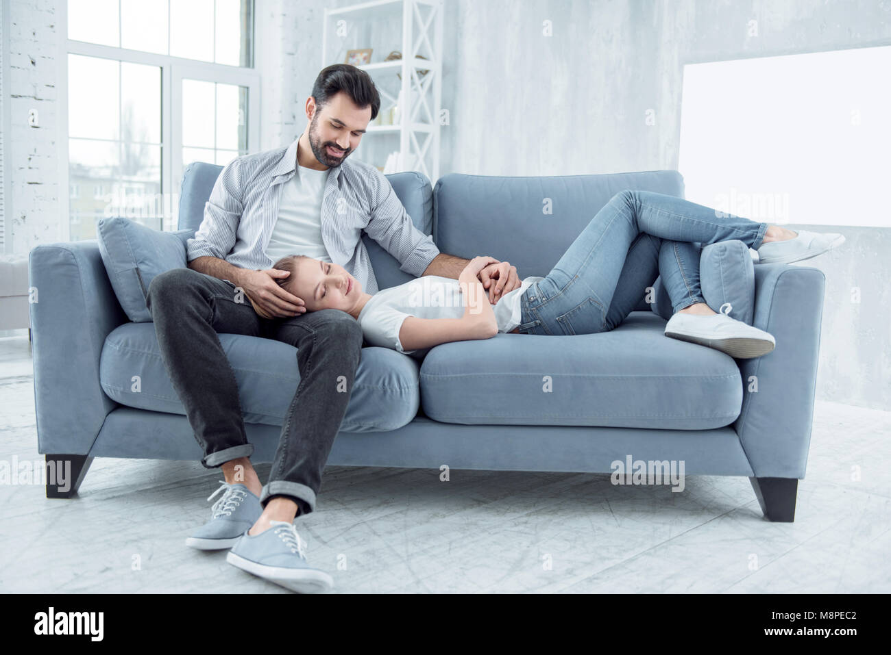 Relaxed female person lying on the bed Stock Photo - Alamy