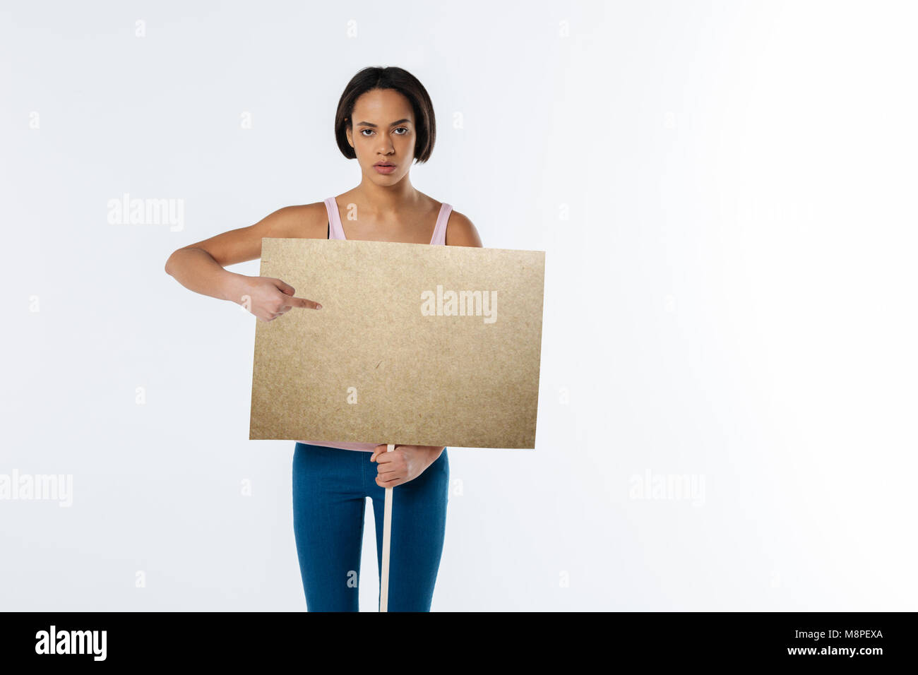 Unhappy serious woman pointing hi-res stock photography and images - Alamy